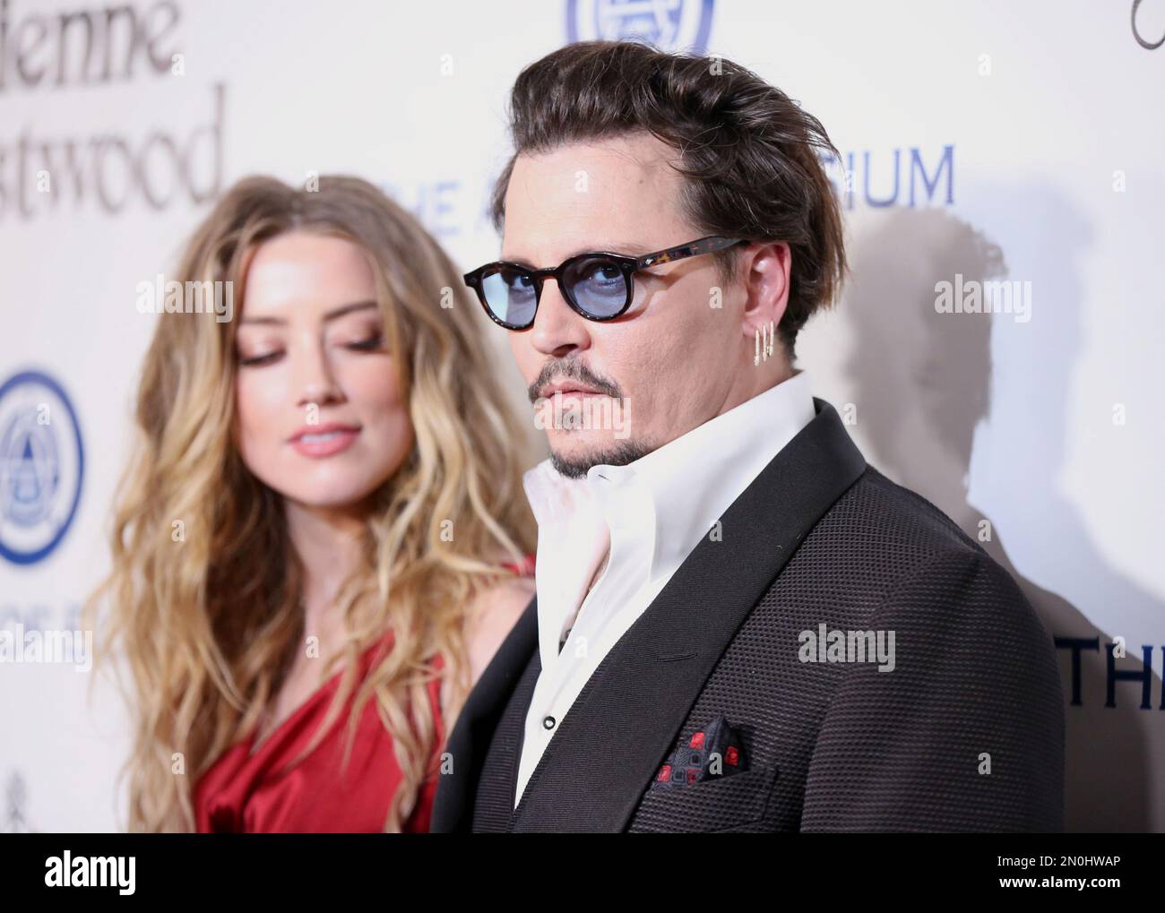 Amber Heard, left, and Johnny Depp arrive at The Art of Elysium's Ninth ...