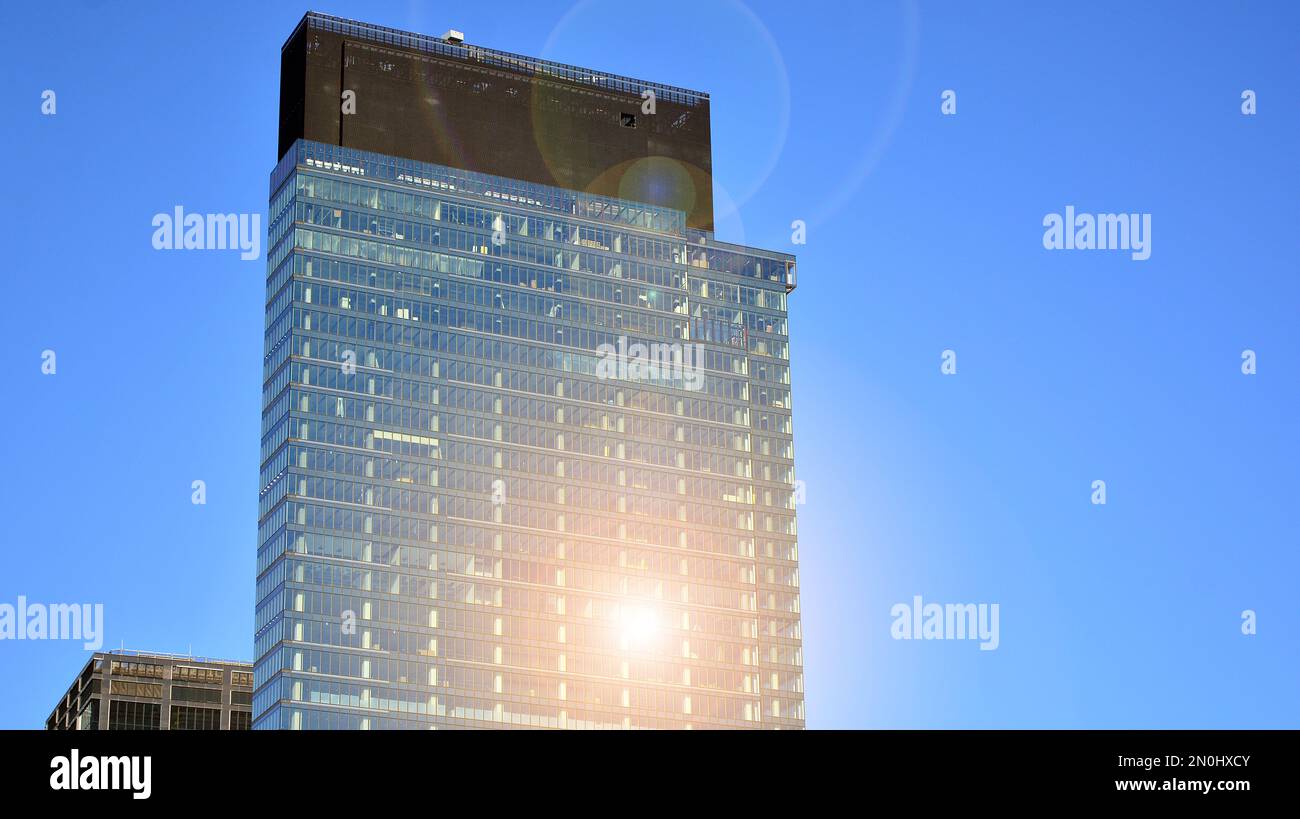 Blue curtain wall made of toned glass and steel constructions under ...
