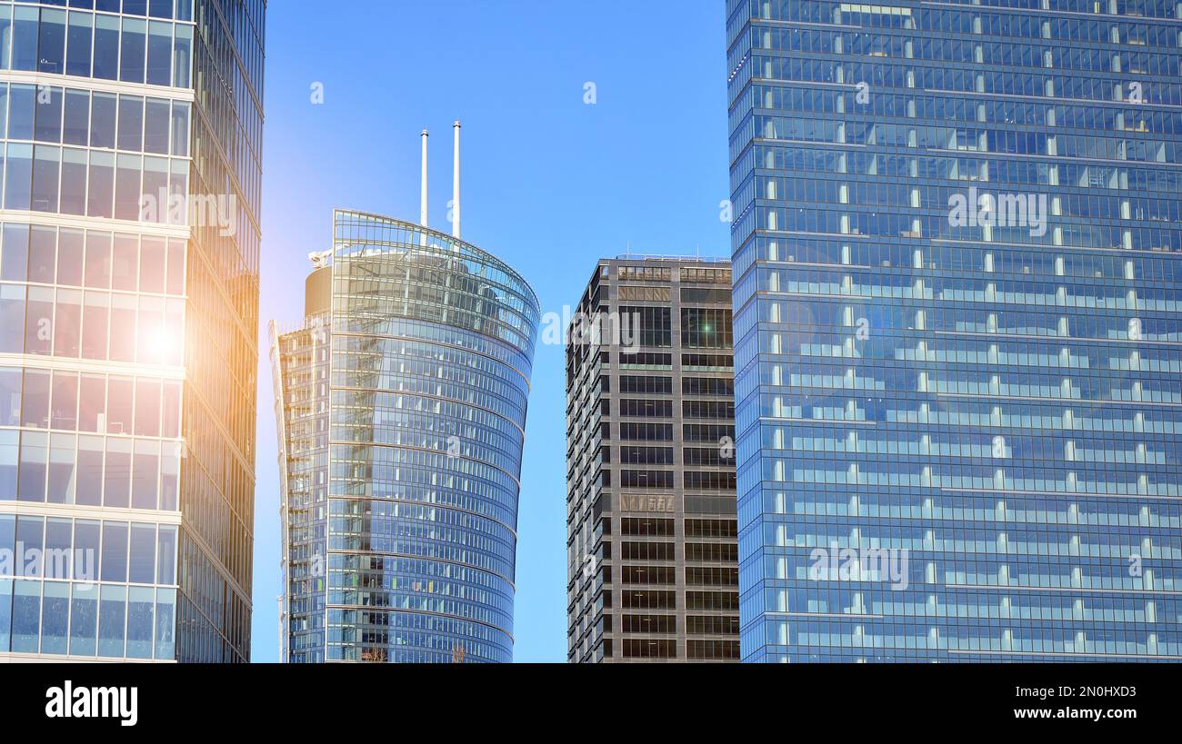 Blue curtain wall made of toned glass and steel constructions under ...