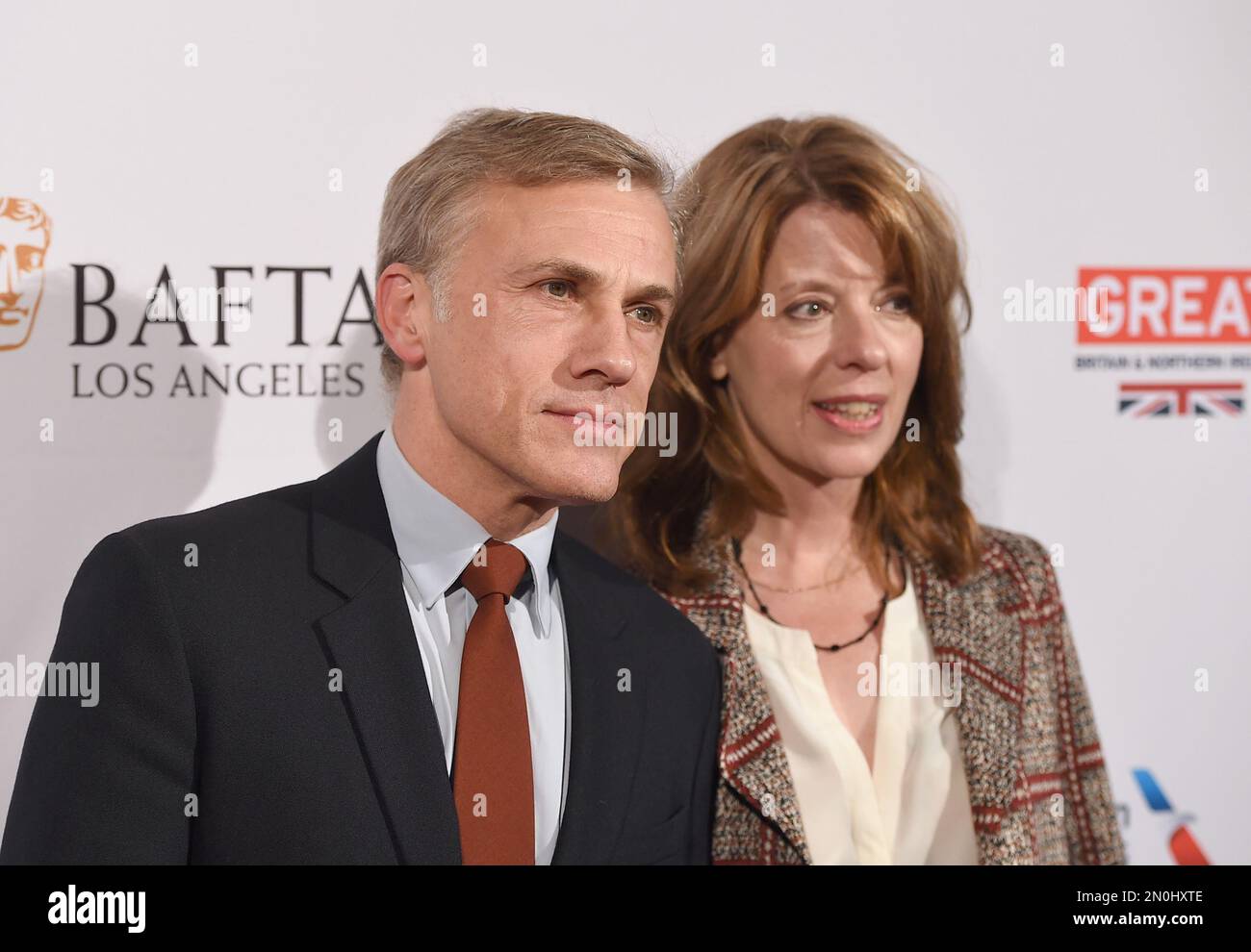 Christoph Waltz, left, and Judith Holste arrive at the BAFTA Awards ...