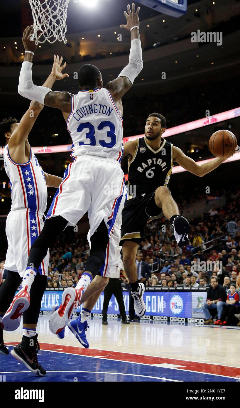 Toronto Raptors' Cory Joseph, right, tries to pass the ball around ...