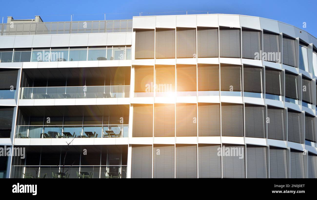 Blue curtain wall made of toned glass and steel constructions under ...