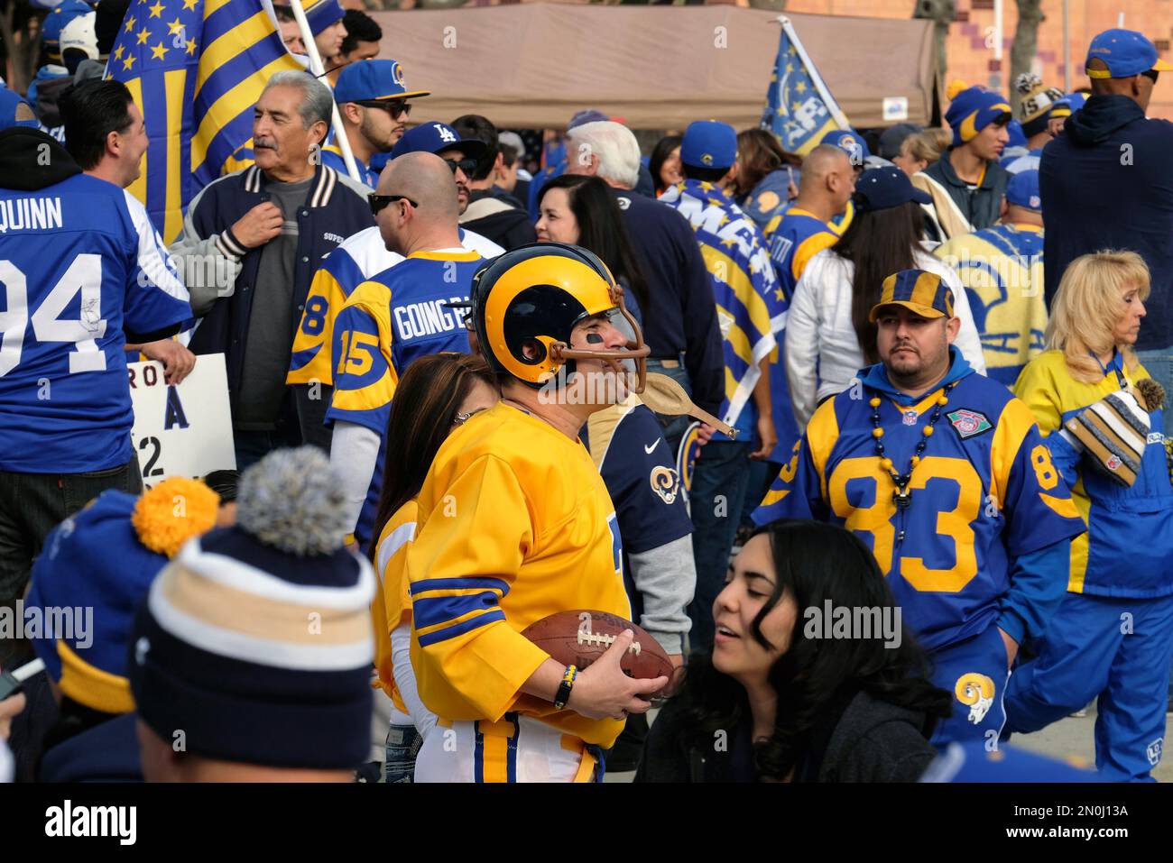 Ram fan Duane Vallejos. center, dressed in a Rams uniform participates ...