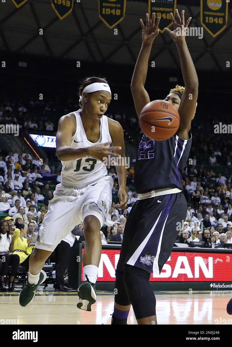 Baylor's Nina Davis (13) passes the ball around TCU's Jordan Moore (22 ...