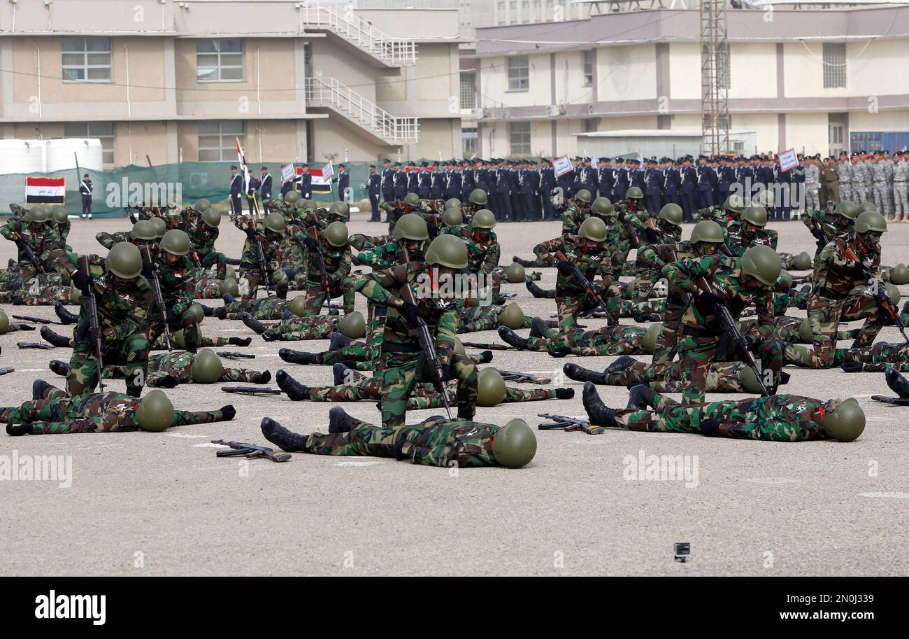Iraqi federal police officers demonstrate their skills during a ...
