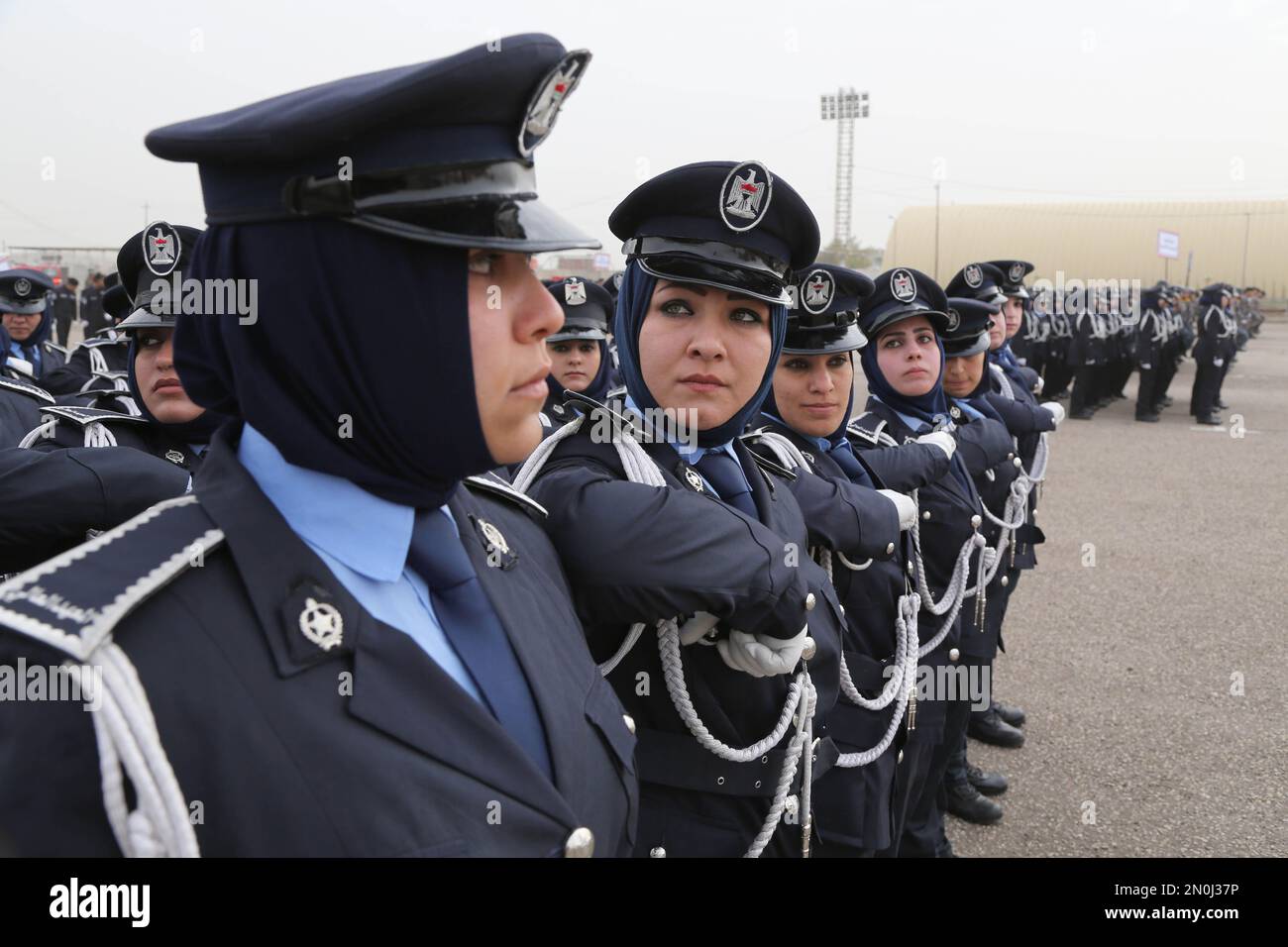 Iraqi federal police officers participate in a ceremony marking Police ...