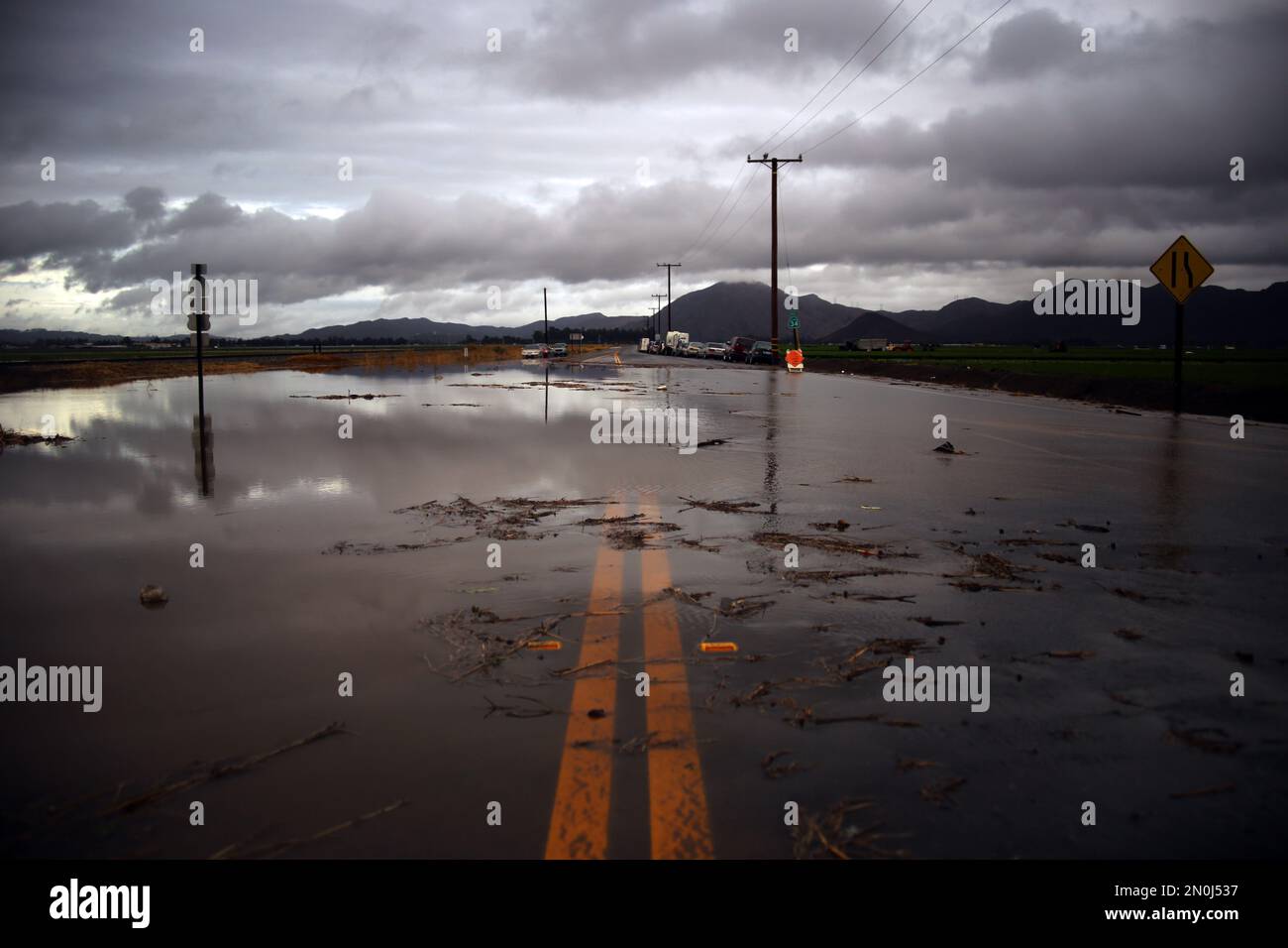 Water covers a closed Las Posas Road near Camarillo, Calif., after ...
