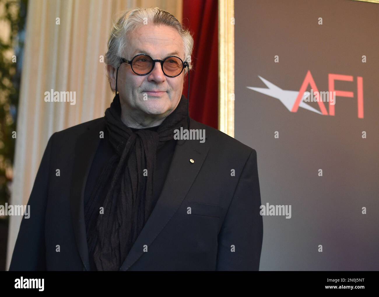 George Miller arrives at the AFI Awards at the Four Seasons Hotel on ...
