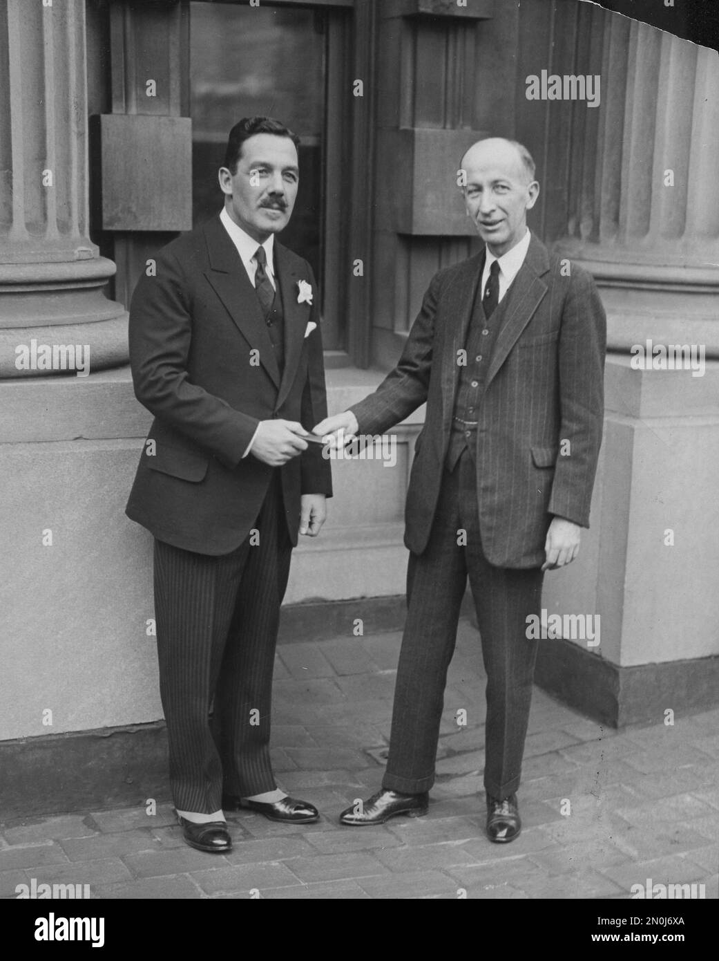 Grover A. Whalen, left, receives a shield of office from Joseph A ...