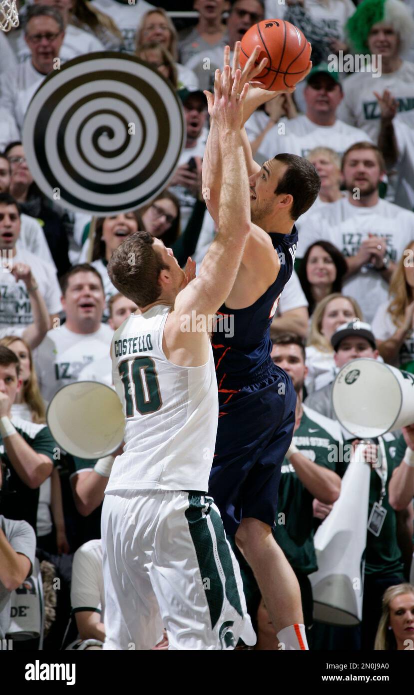 Illinois' Maverick Morgan, right, shoots against Michigan State's Matt ...