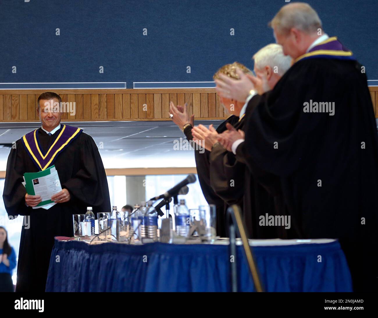 Pennsylvania Supreme Court Justice David N. Wecht, left, is applauded ...