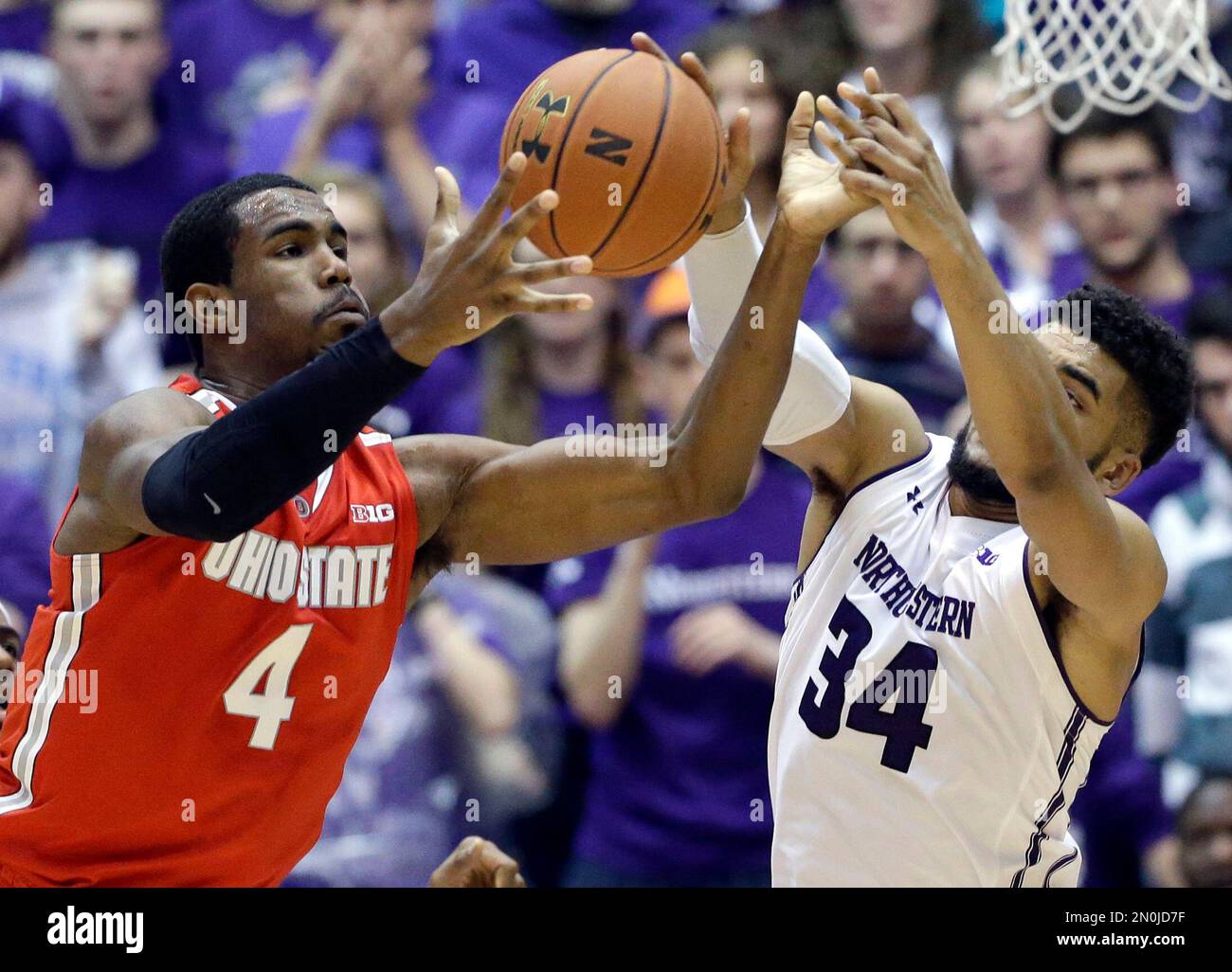 Ohio State forward/center Daniel Giddens, left, and Northwestern guard ...