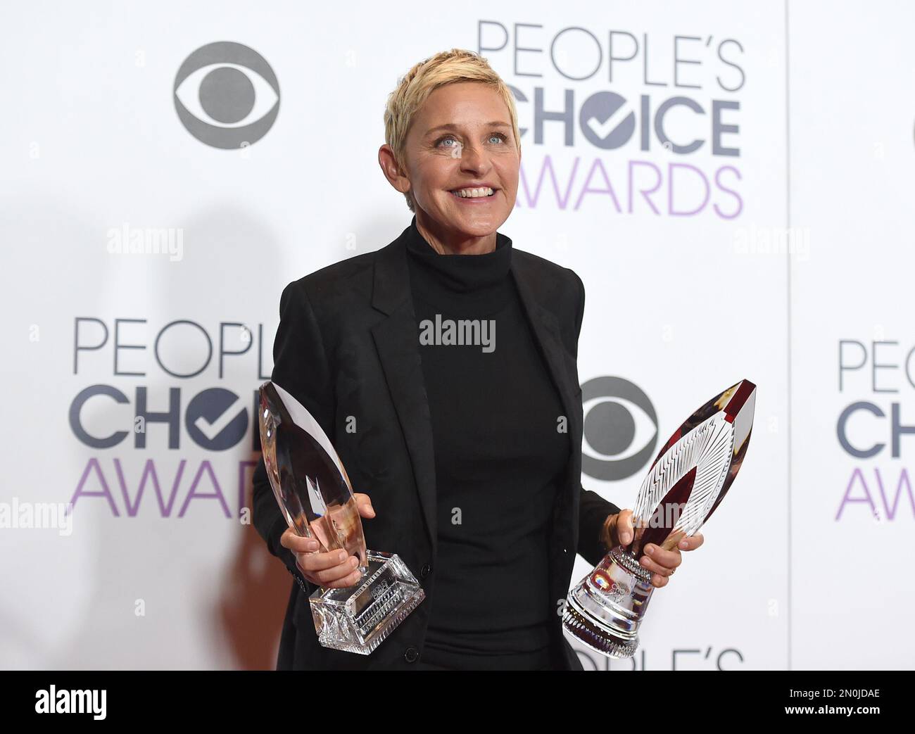 Ellen DeGeneres poses in the press room with the award for favorite ...