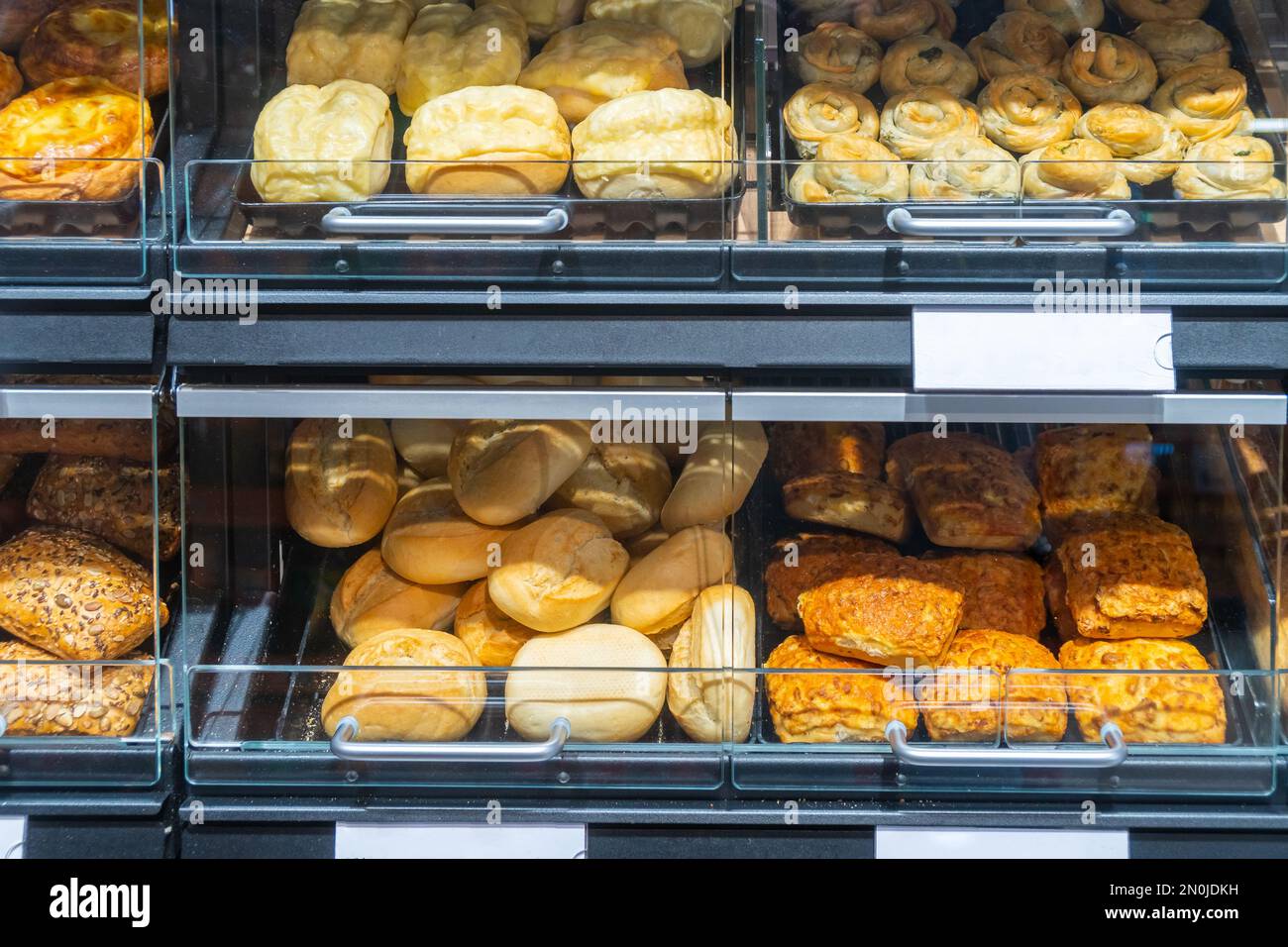 Bakery products on shelves and counters. Shelves with different sorts ...