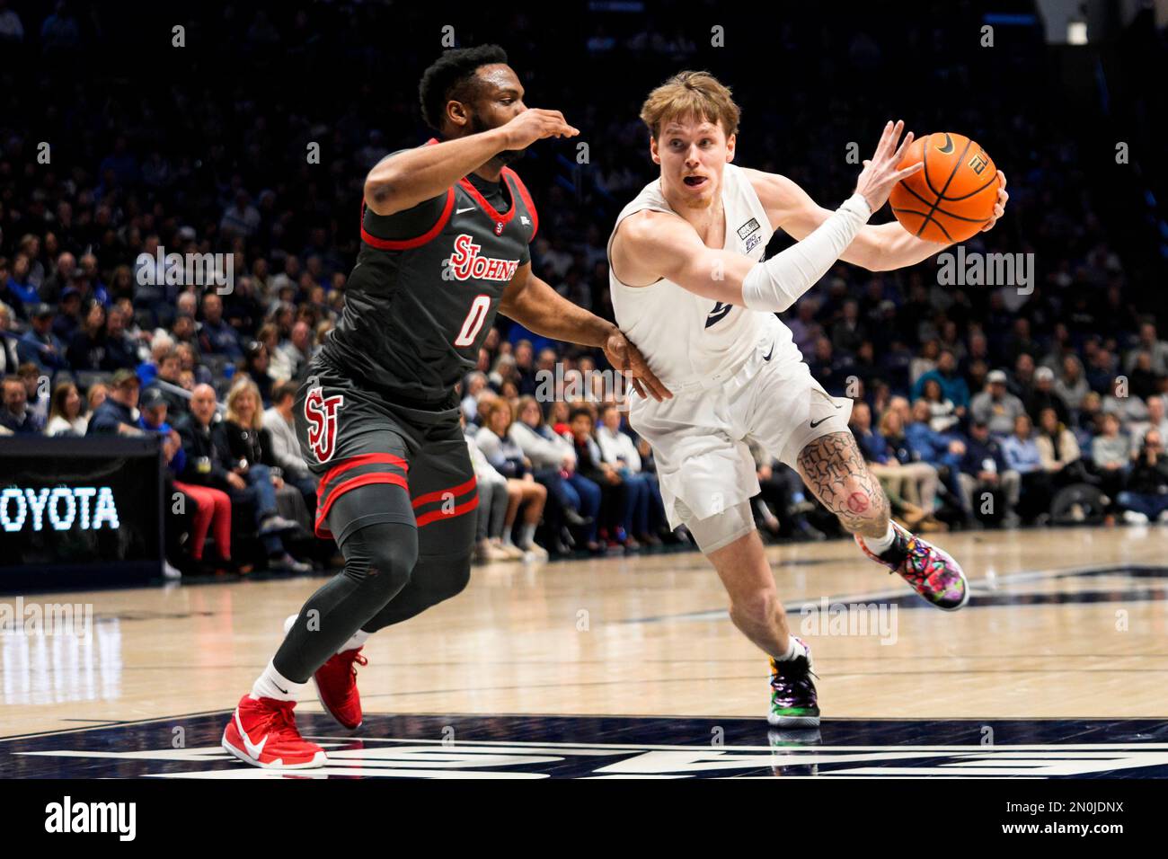Xavier guard Adam Kunkel, right, drives against St. John's Posh ...
