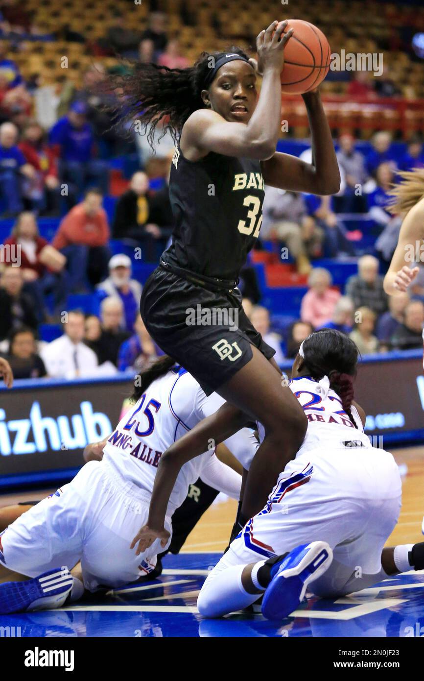 Baylor forward Beatrice Mompremier (32) rebounds over Kansas forward ...