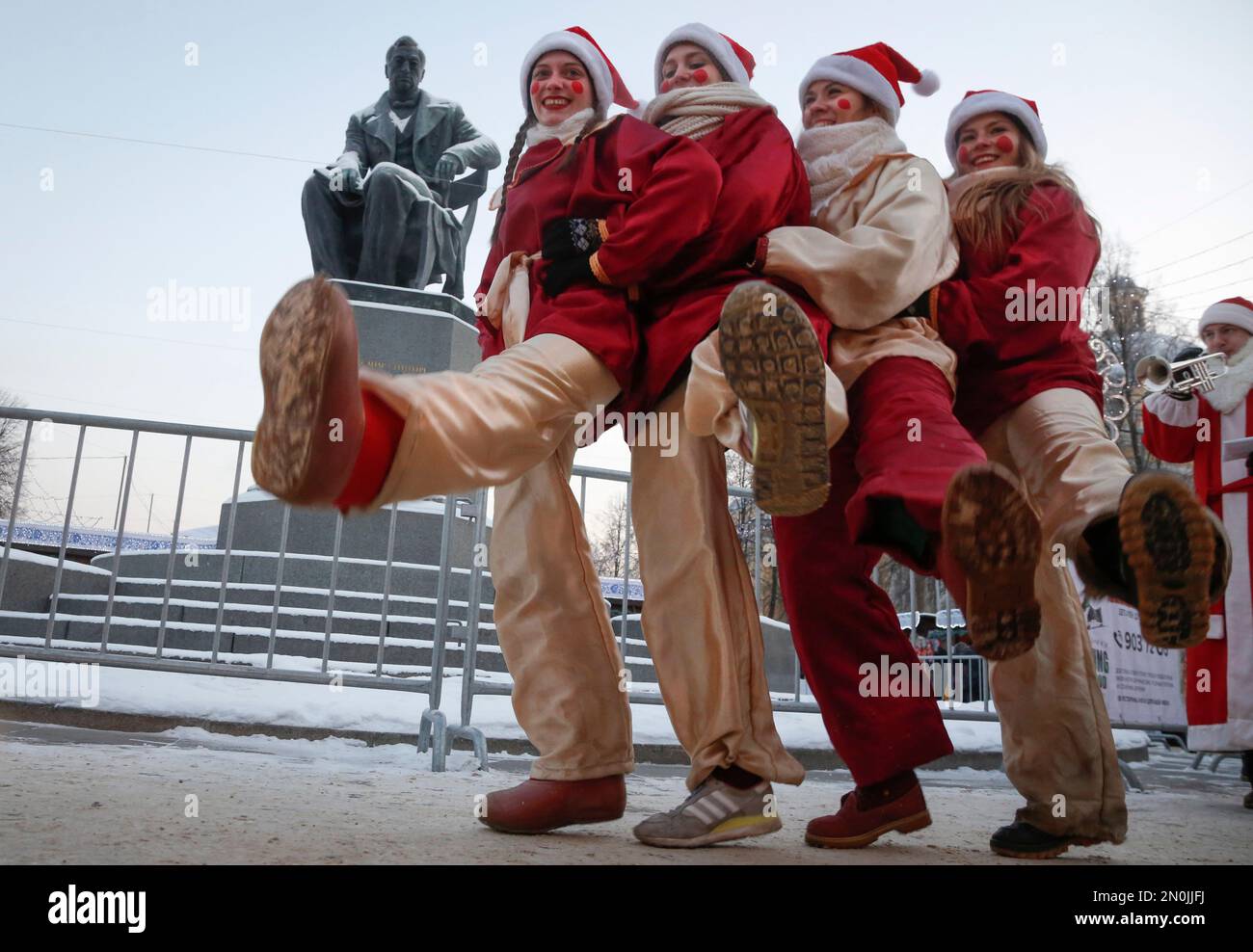 Actors dance during celebration of incoming Orthodox Christmas next to ...