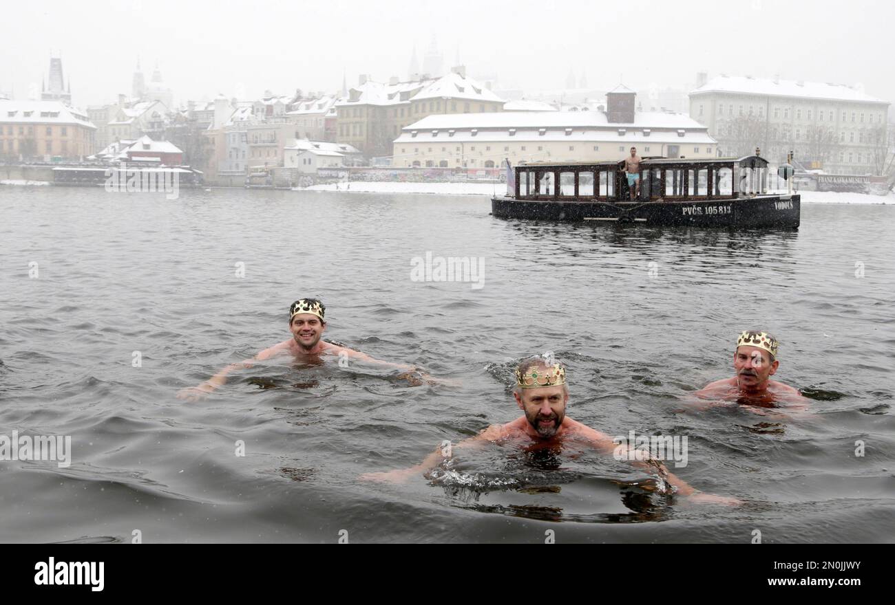 Swimmers take part in the traditional Three Kings swim in the Vltava ...