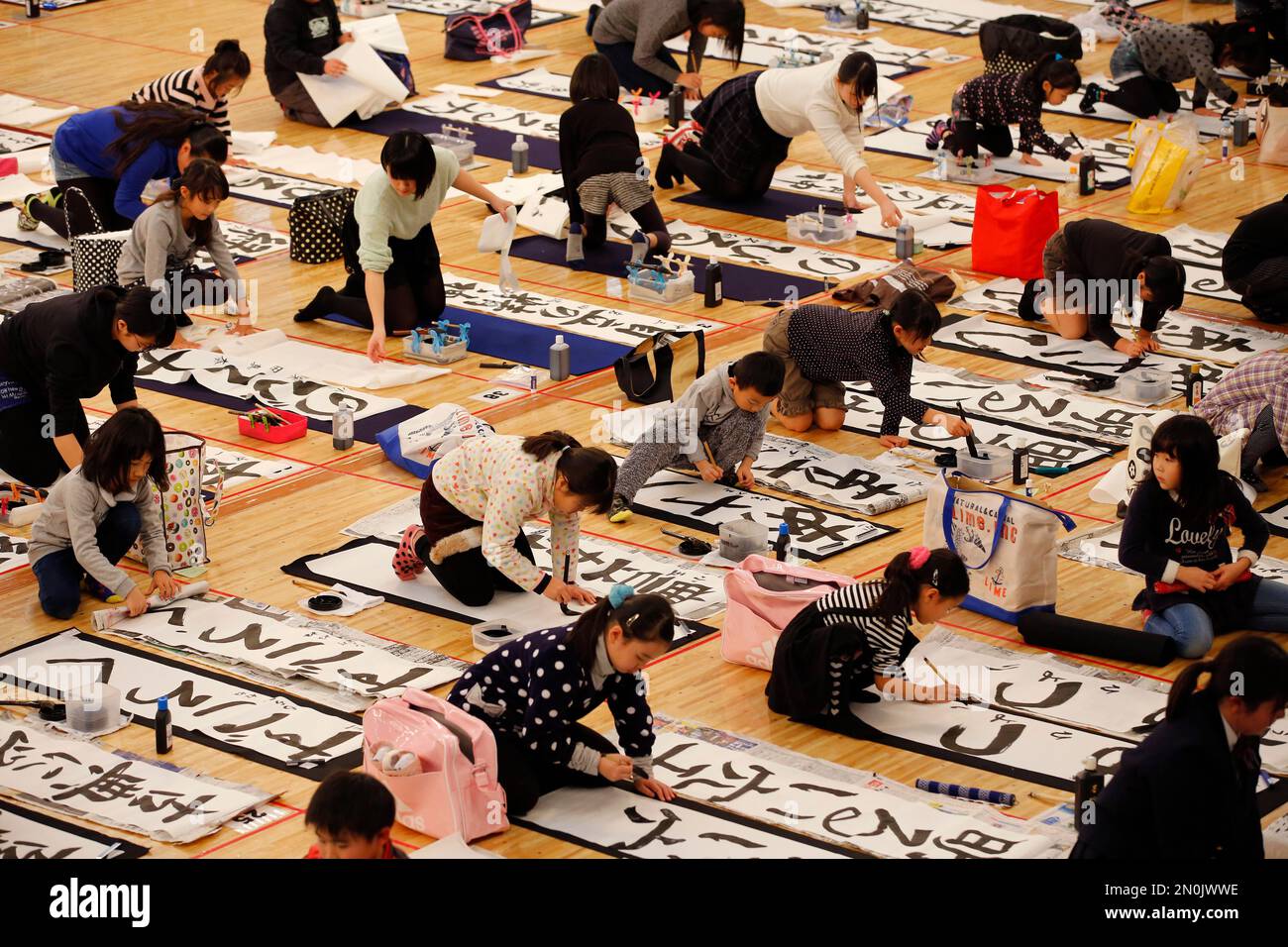 Participants write traditional Japanese calligraphy during the annual ...