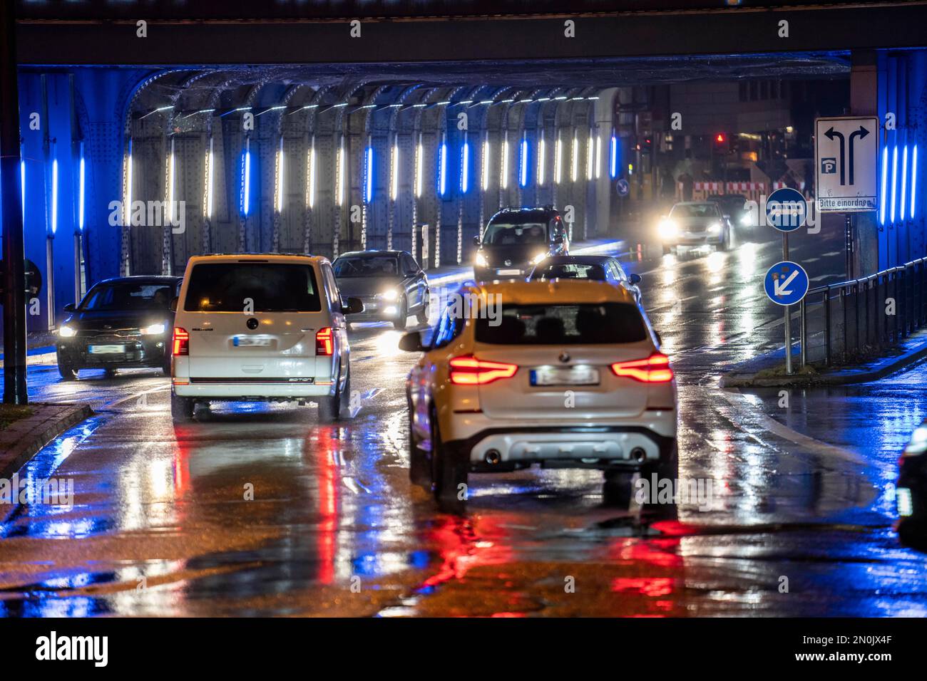 Illuminated subway at the main station, car traffic, rainy weather ...