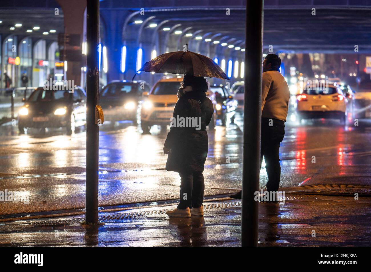 Illuminated subway at the main station, passers-by at a pedestrian ...