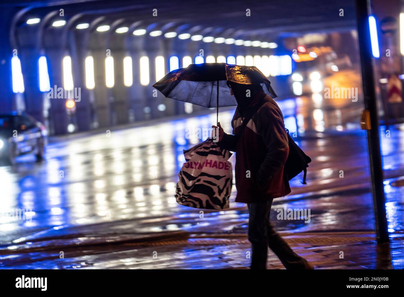 Illuminated subway at the main station, passers-by at a pedestrian ...