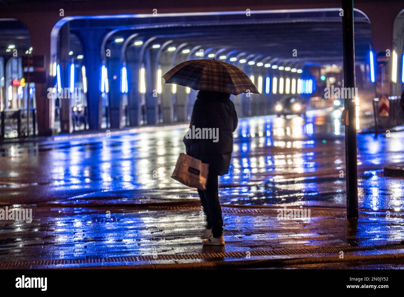 Illuminated subway at the main station, passers-by at a pedestrian ...