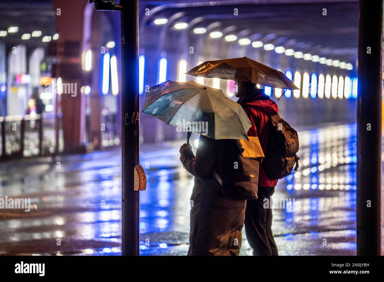 Illuminated subway at the main station, passers-by at a pedestrian ...