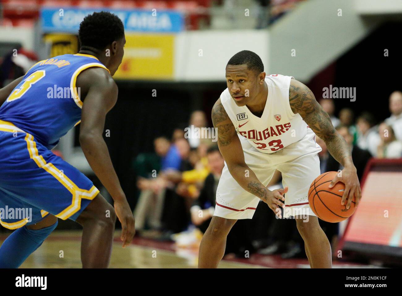Washington State's Charles Callison (23) dribbles while defended by ...