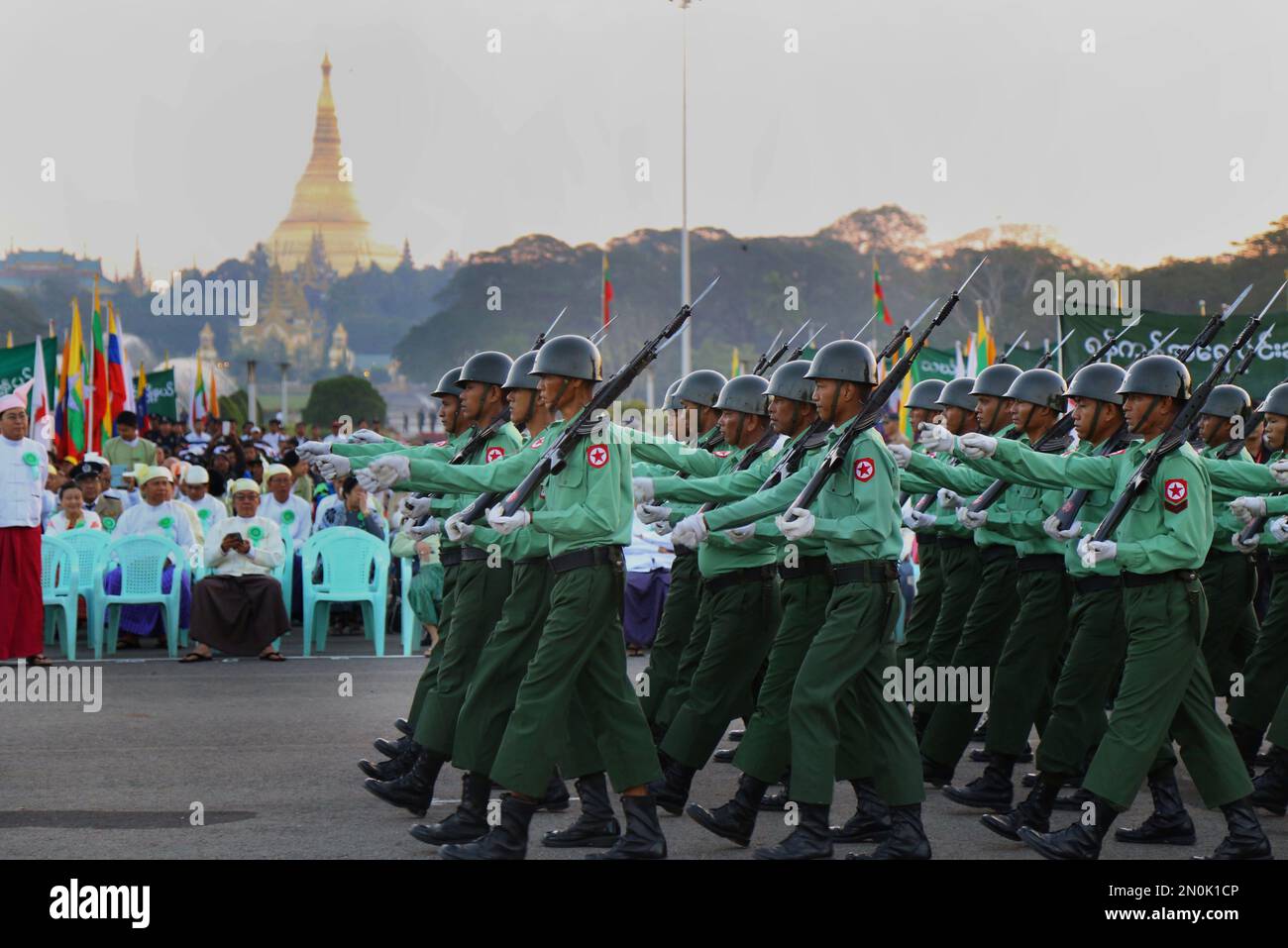 Myanmar army officers march in front of the historic Shwedagon Pagoda during a ceremony to mark ...