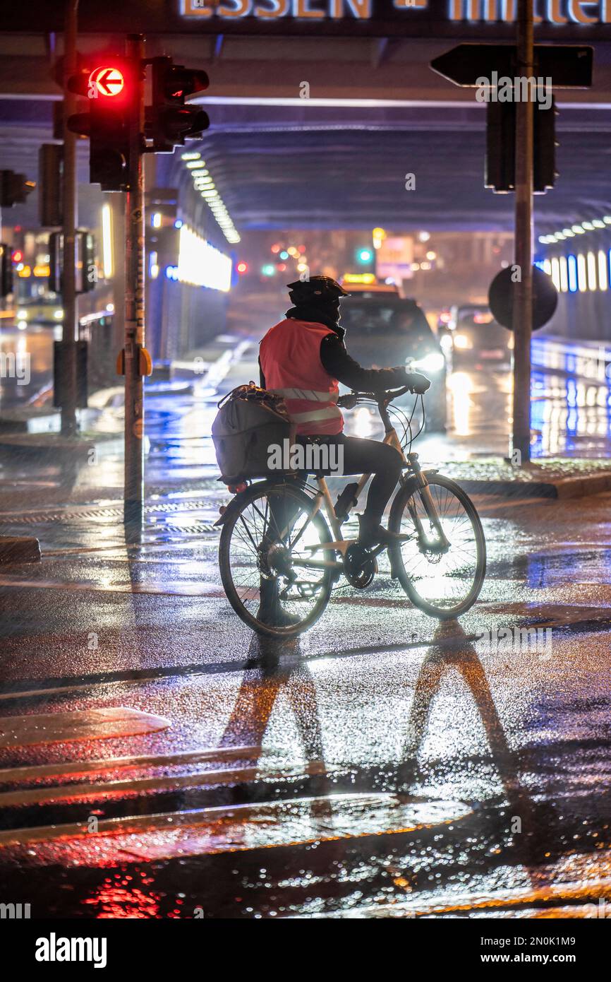 Street at the main station, cyclist, rainy weather, city centre, in the ...