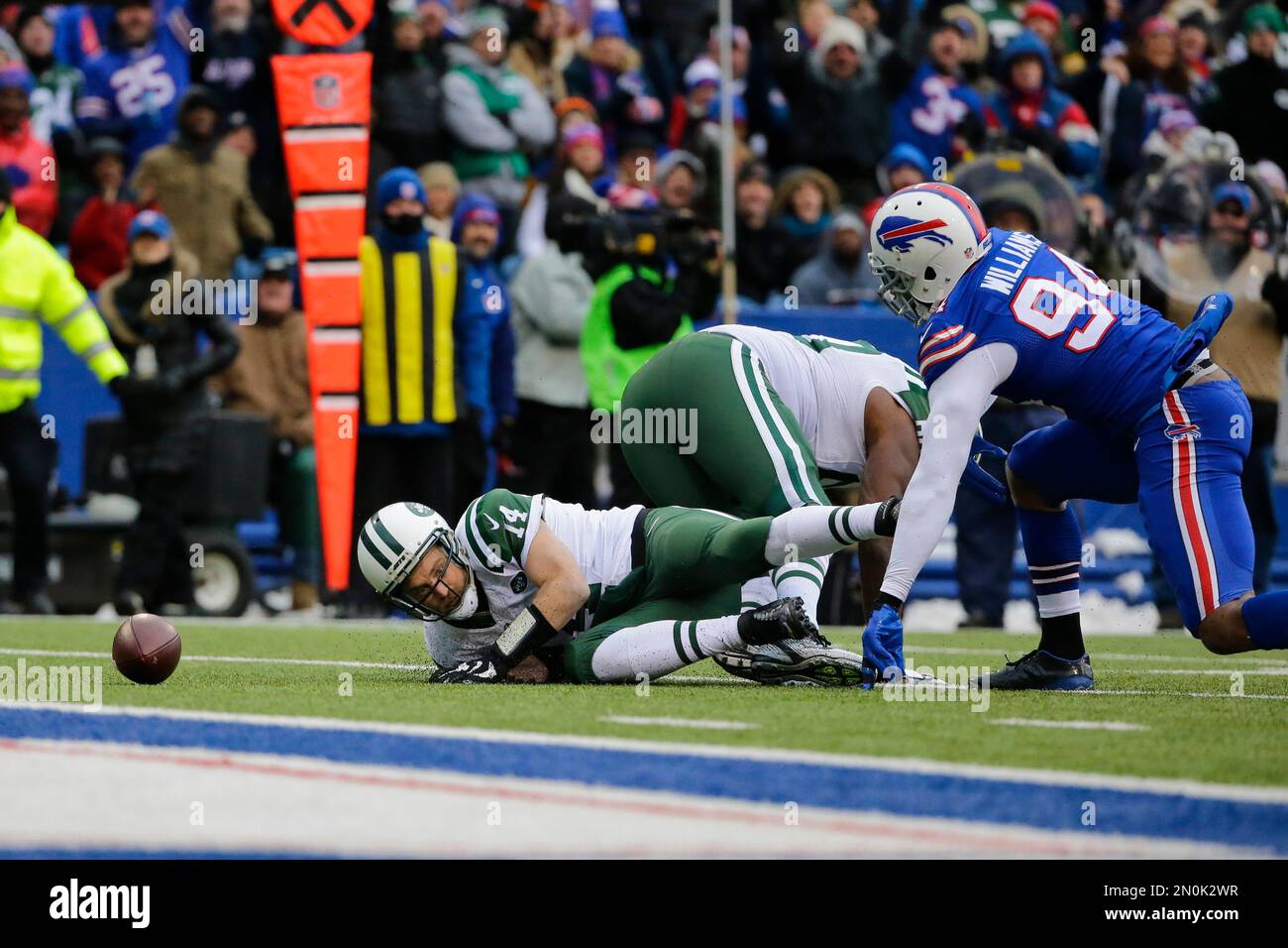 New York Jets quarterback Ryan Fitzpatrick (14) watches the ball he ...