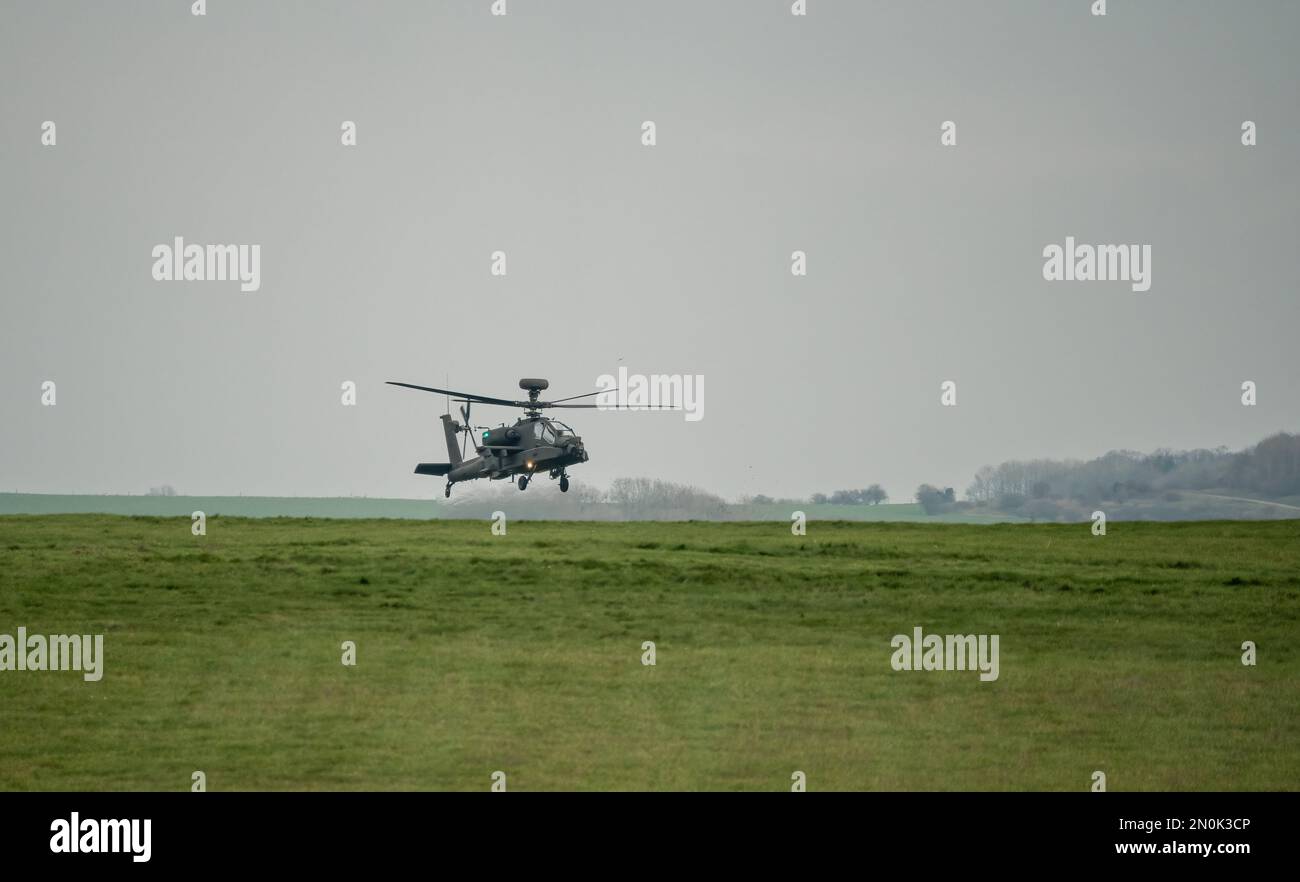 A military helicopter landing in a field Stock Photo - Alamy