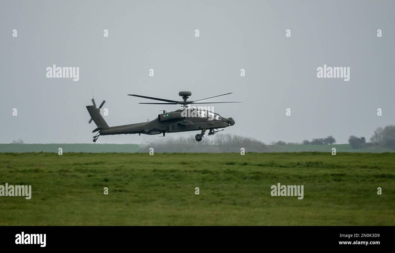 A military helicopter landing in a field Stock Photo - Alamy
