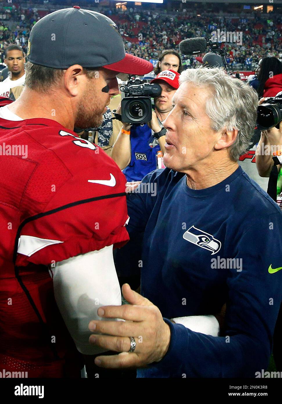 Seattle Seahawks head coach Pete Carroll, right, talks with Arizona ...