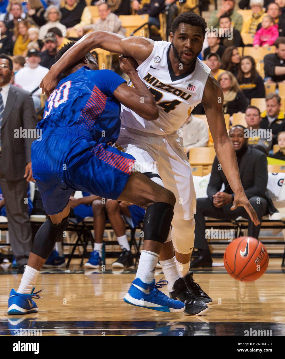 Missouri's Kevin Puryear, right, dribbles around Savannah State's ...