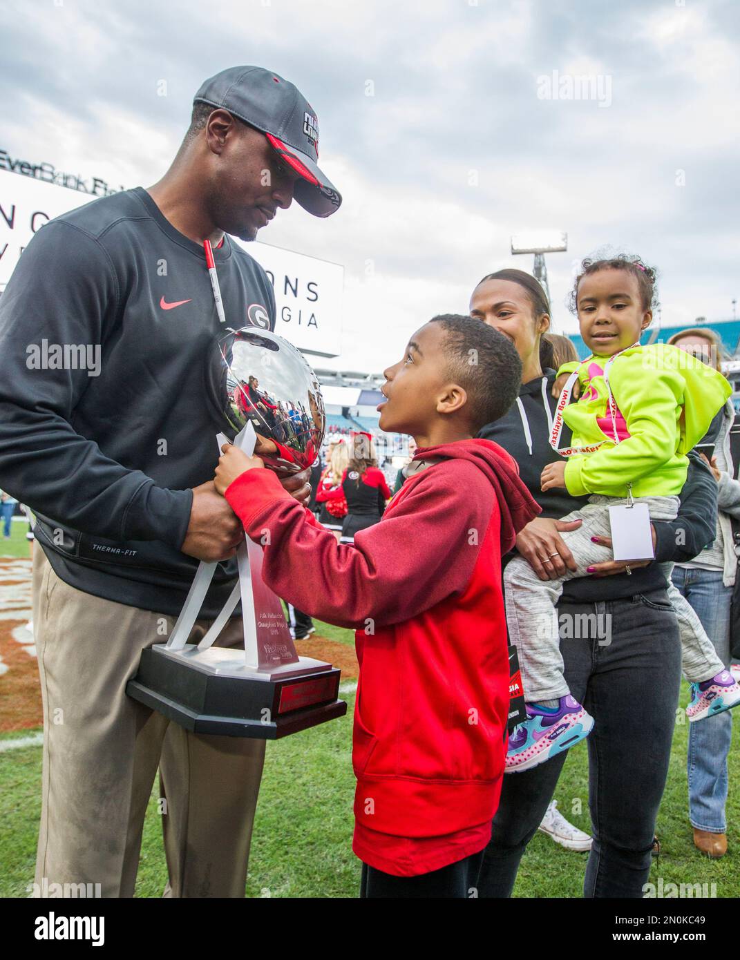 Georgia interim head coach Bryan McClendon and his 8-year-old son Bam ...