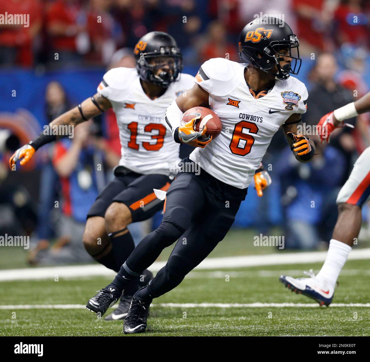 Oklahoma State cornerback Ashton Lampkin (6) returns an interception in ...