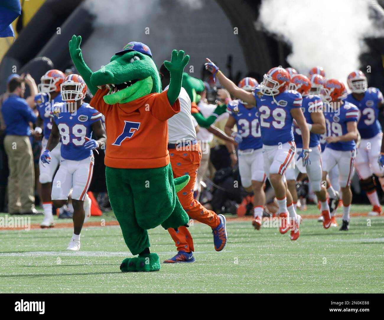 Albert the alligator leads the Florida players on the field during the ...