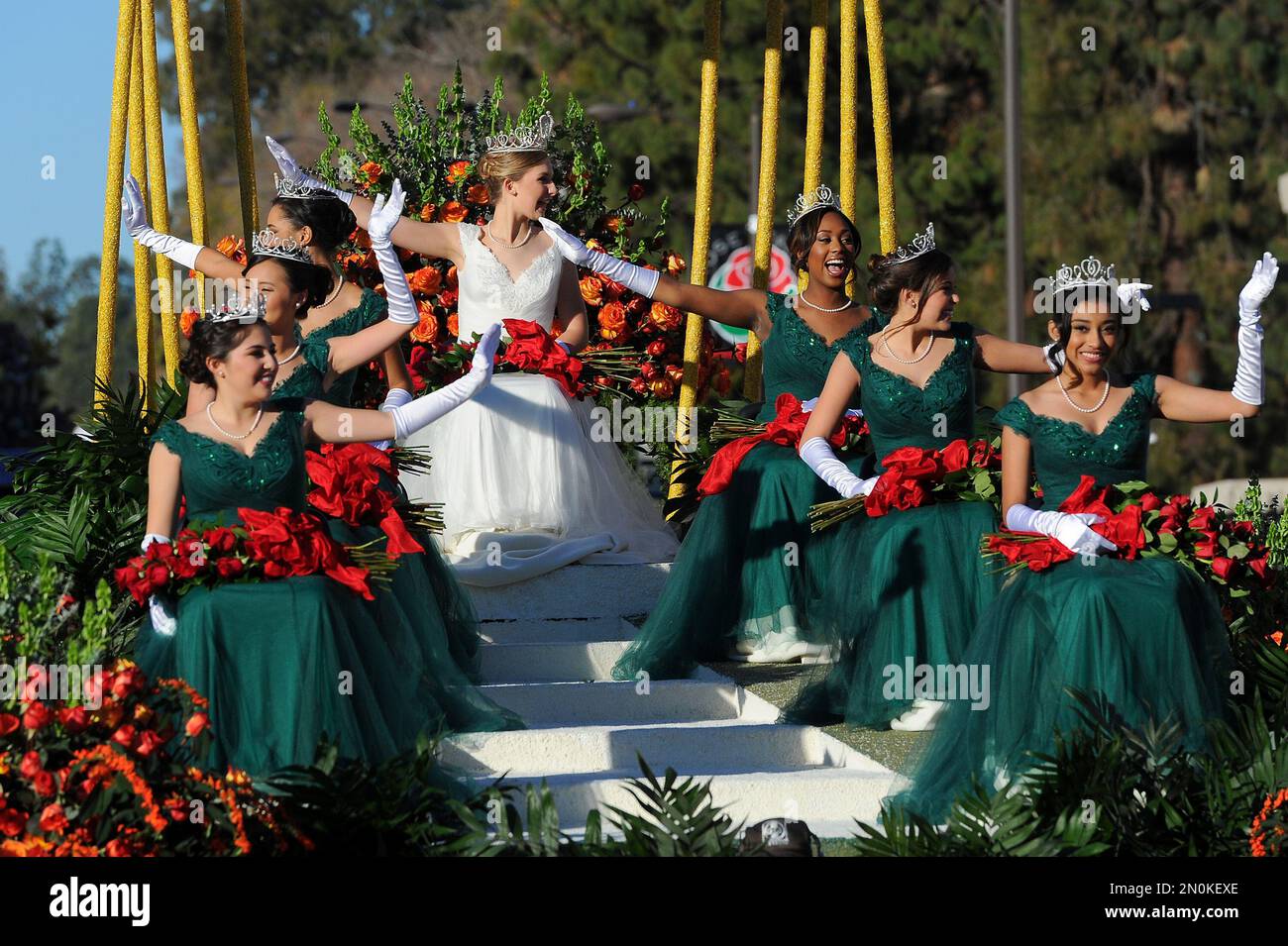 The Rose Queen and her Court ride on a float in the 127th Rose Parade ...