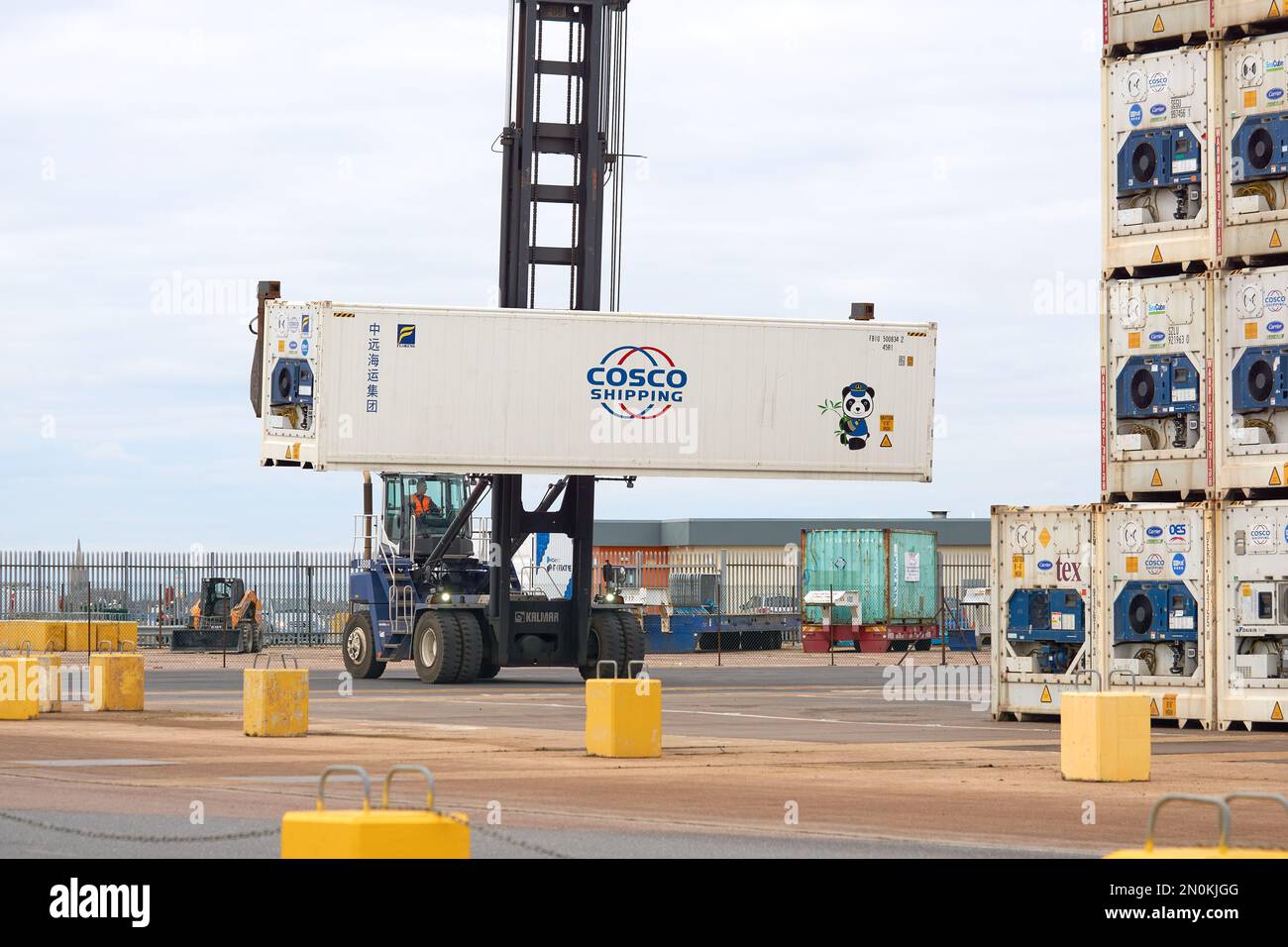 Shipping containers being moved at Felixstowe docks, Suffolk, UK Stock ...