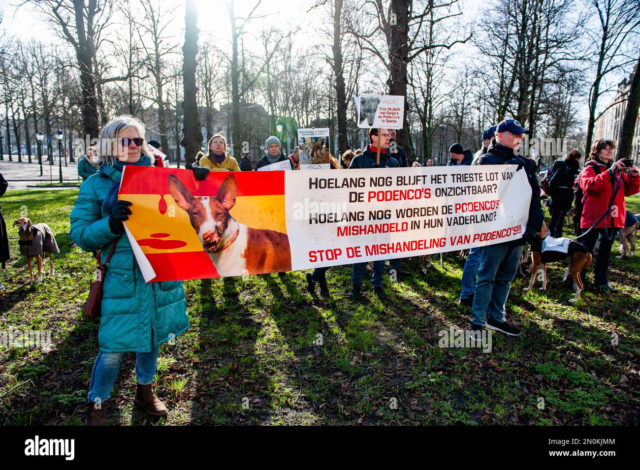 Protesters are seen holding a big banner against hunting during the ...