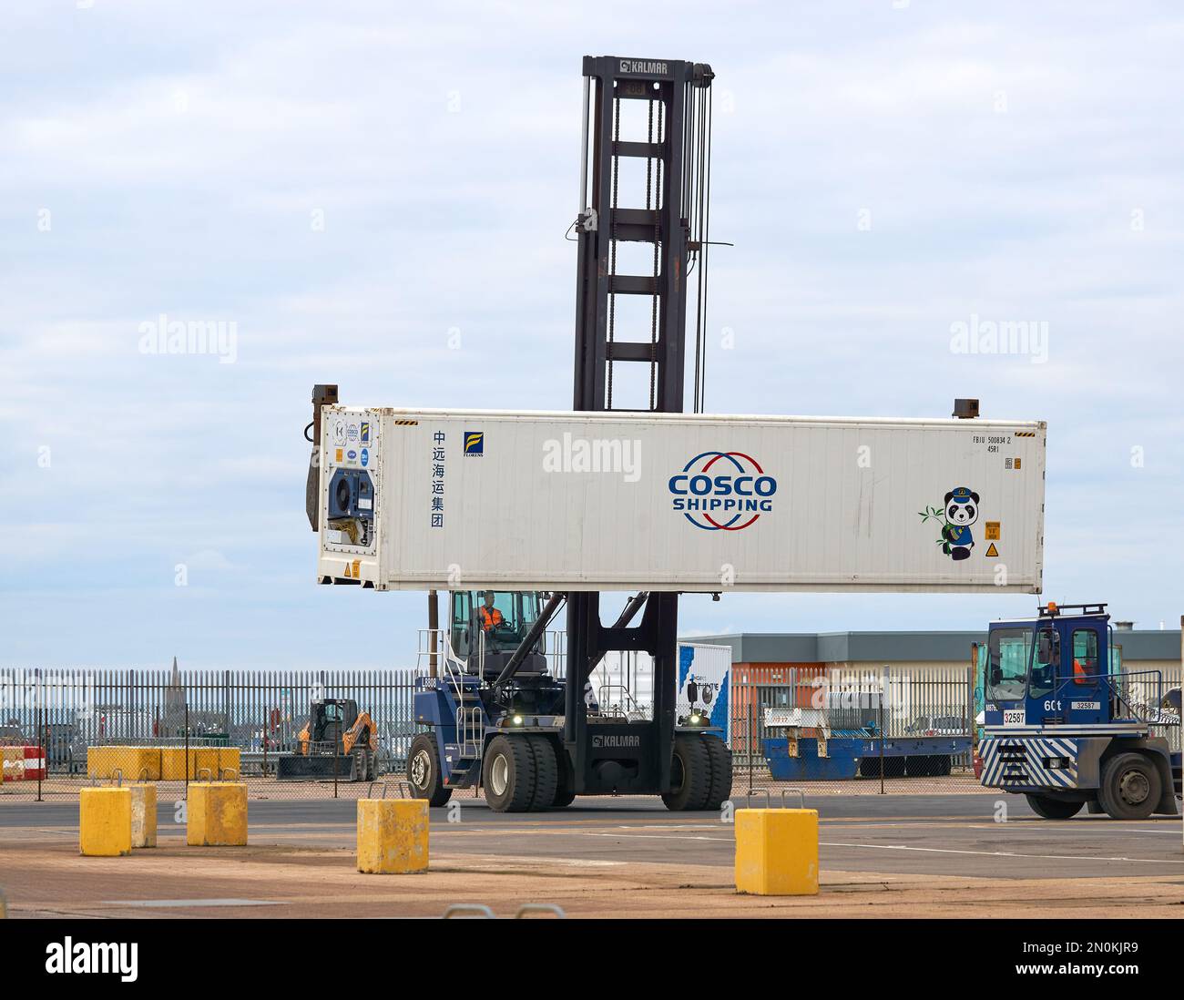 Shipping containers being moved at Felixstowe docks, Suffolk, UK Stock ...
