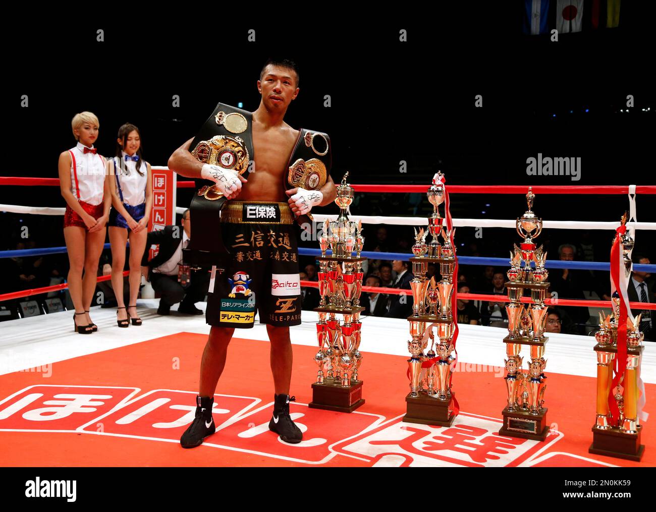 Japanese champion Takashi Uchiyama poses for a photo with his trophies ...