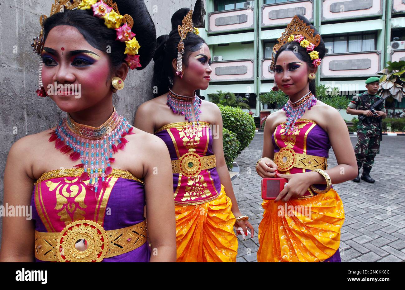 Balinese girls in traditional costumes gather during a parade for this ...