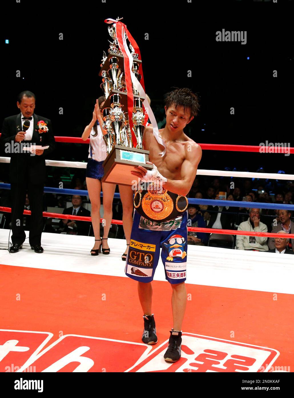 Japanese champion Ryoichi Taguchi poses with his trophy after defending ...