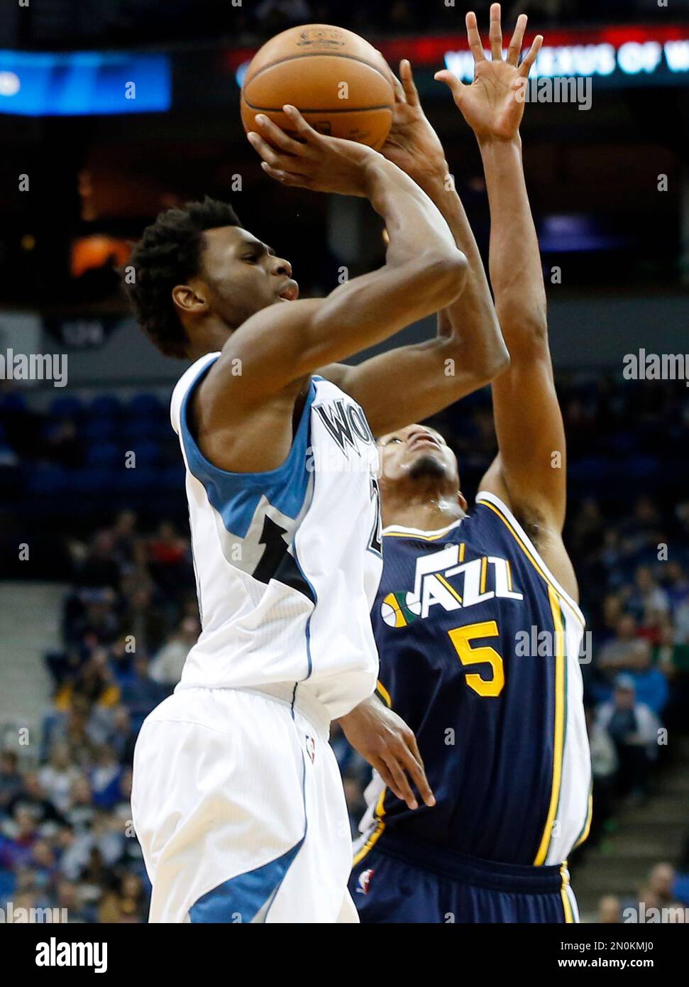Minnesota Timberwolves’ Andrew Wiggins, left, shoots as Utah Jazz’s ...