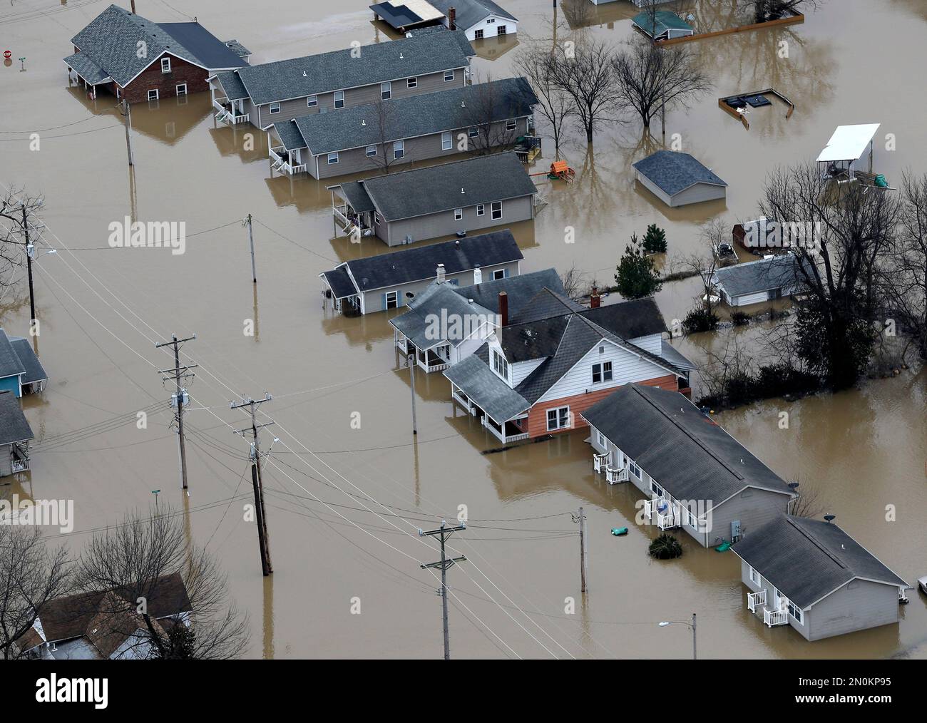 In this aerial photo, homes are surrounded by floodwater, Wednesday ...