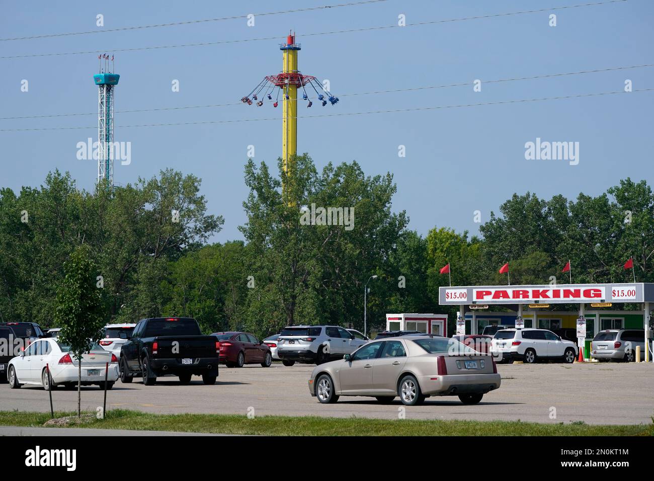 FILE - Visitors arrive at the Adventureland Park amusement park, July 6 ...