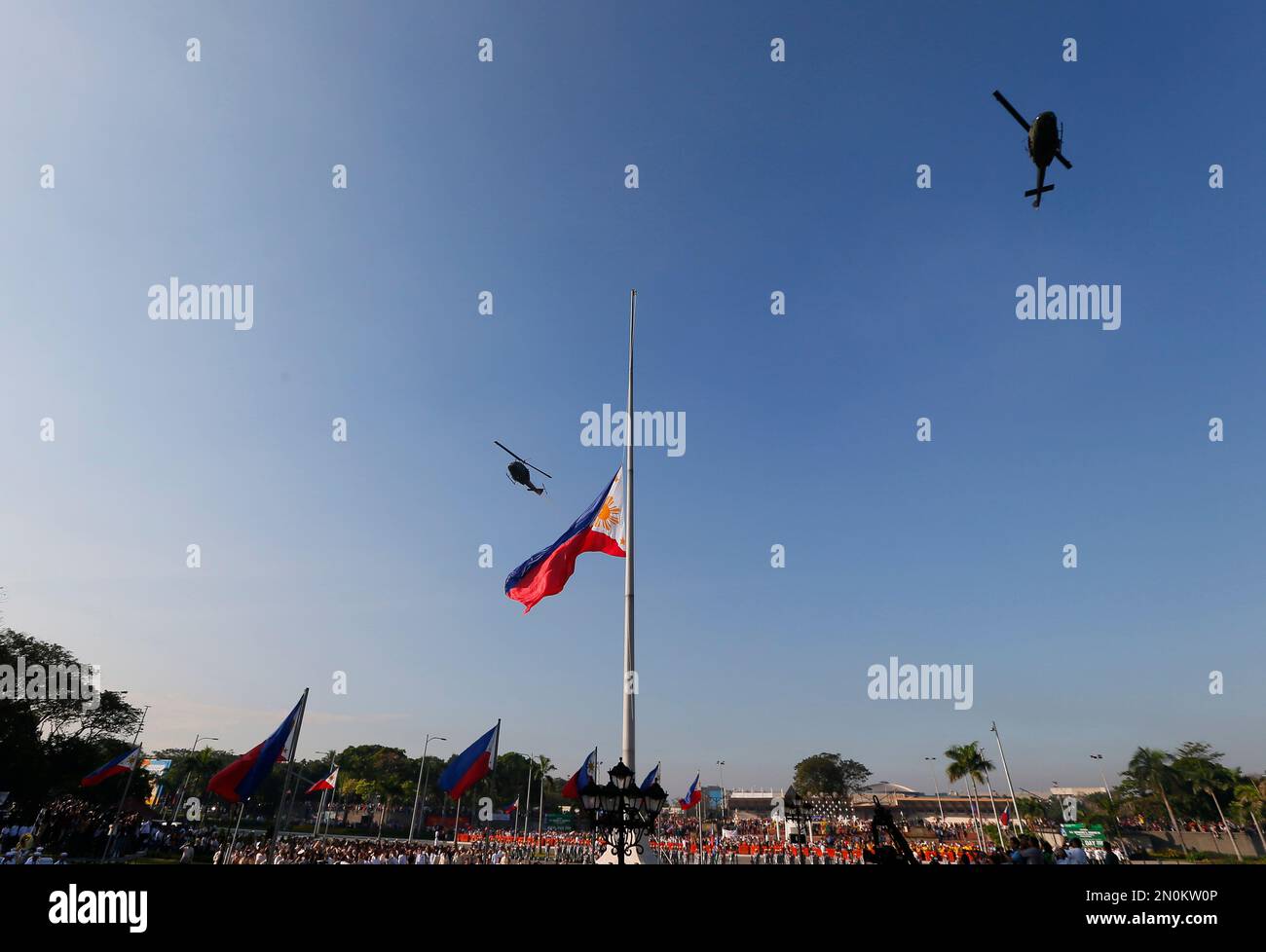Two UH-1H helicopters of the Philippine Air Force drop flowers during ...